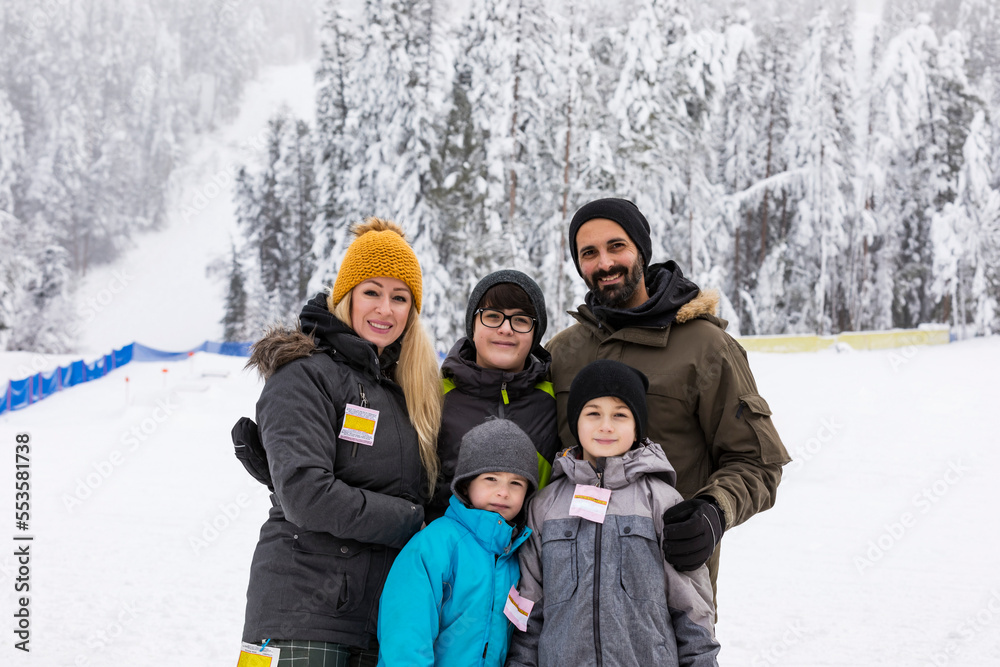Parents and their children posing for a picture while vacationing at a ...