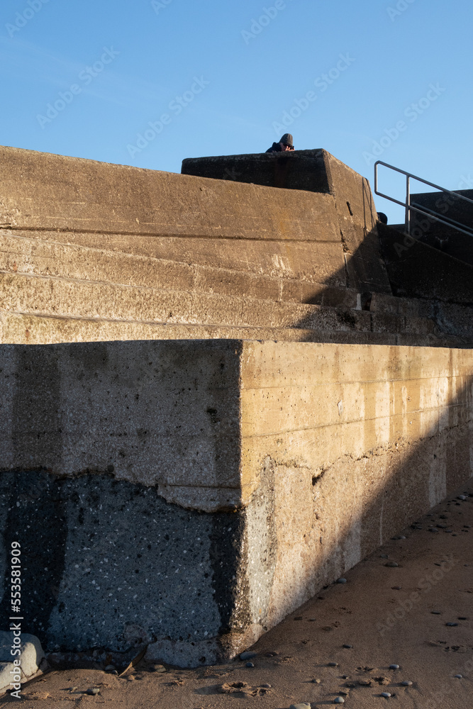 Old decaying cement seafront flood defence wall system. Sea defence sea ...
