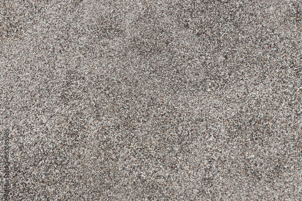 Full frame beach dark sand texture close up in daytime outdoors. Beach ...