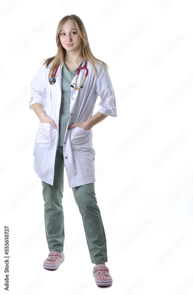 Full length portrait of the female physician in medical uniform with ...