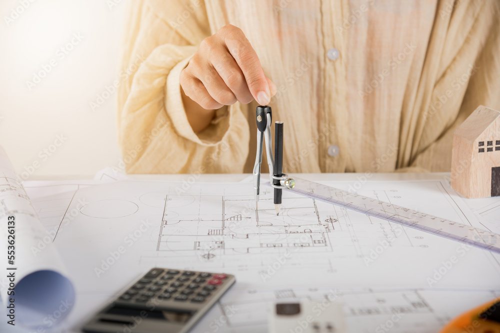 Architect interior design drawing with divider compass on house plan ...