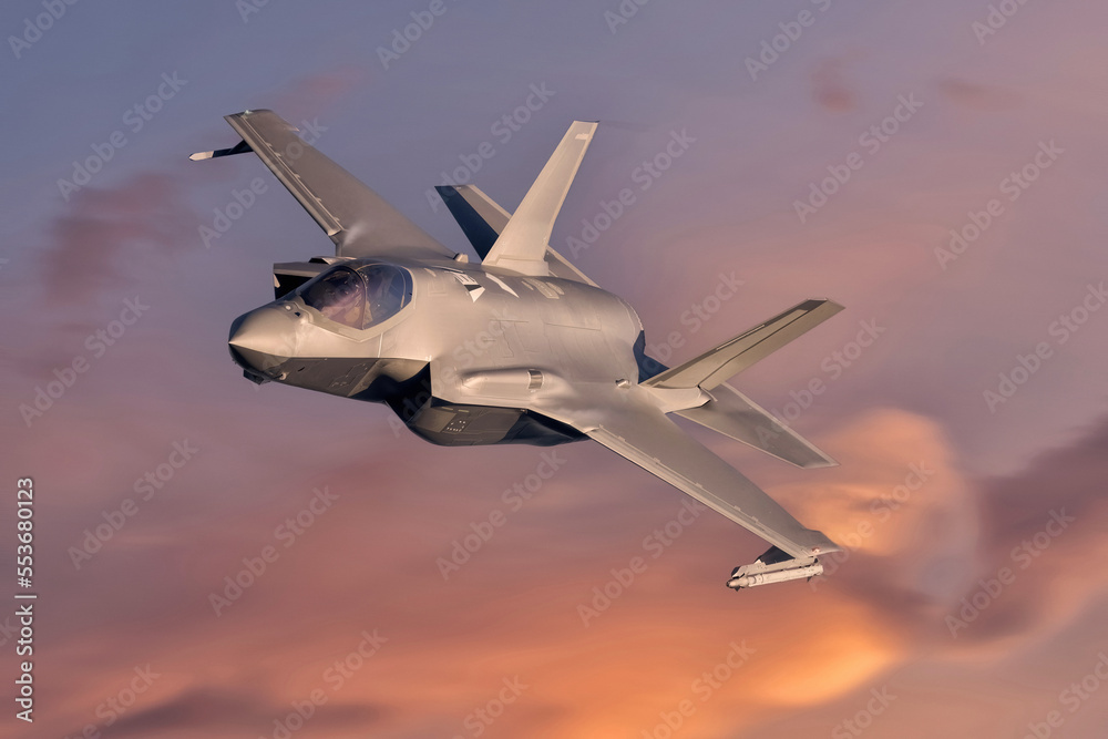 F35 modern fifth generation Fighter jet flying over with missiles on ...