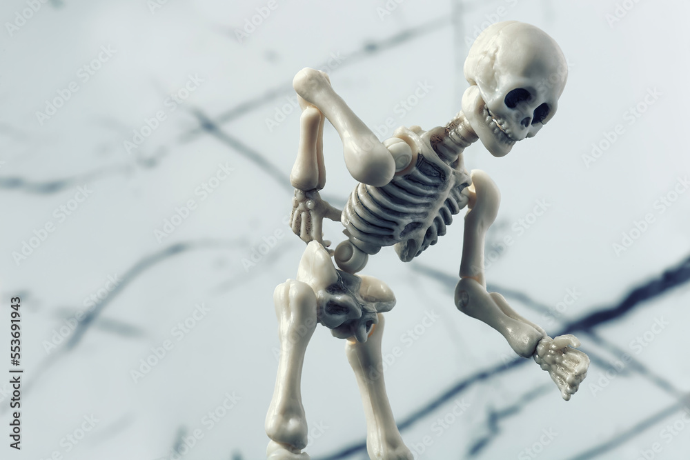 Skeleton figurine held back. Radiculitis concept, chronic back pain ...