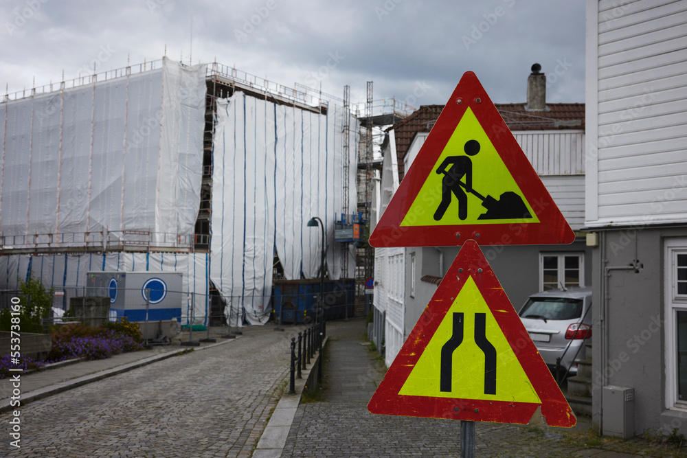 Road signs, building in background Stock Photo | Adobe Stock