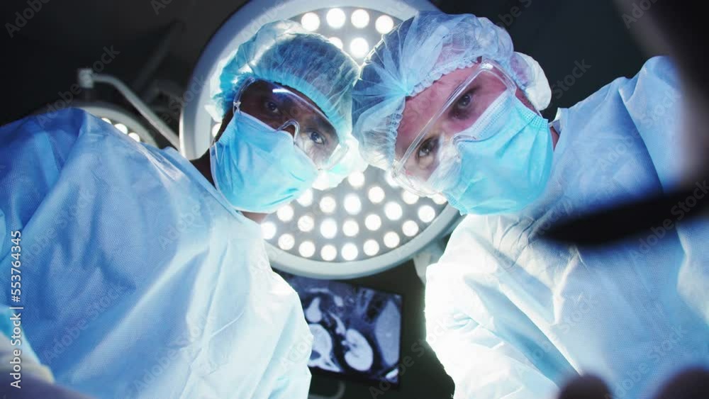 POV low angle view of being operated by professional surgeons using ...