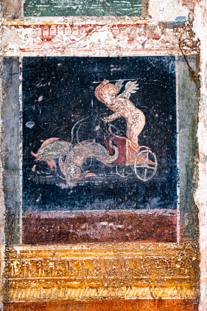 Winged Amorino leads a fish-drawn chariot, a figure of divinity of ...