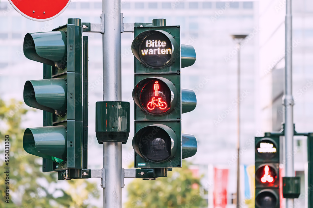 Red forbidding traffic light for pedestrians and cyclists and the ...