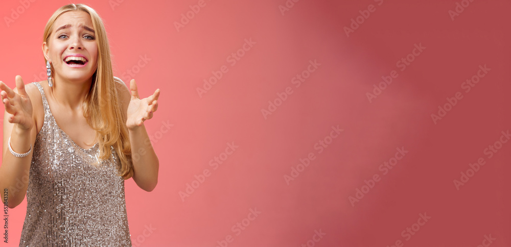 Panicking upset miserable heartbroken blond girl crying raising hands ...