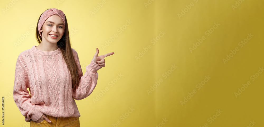 Lifestyle, people, pointing concept. Attractive young girl with long ...