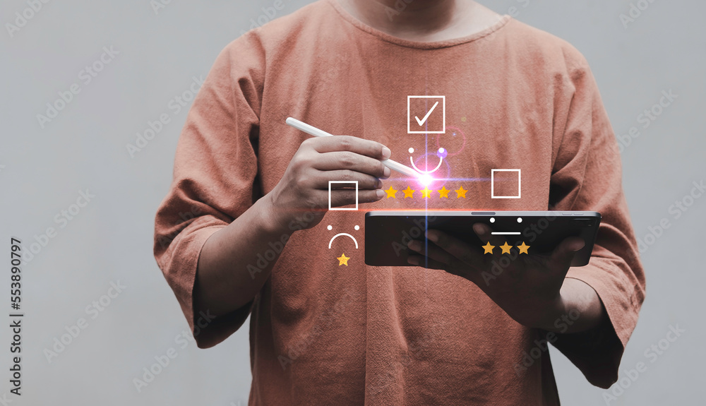 Customer service evaluation, Man using tablet and pressing five star of smile face emoticon ...