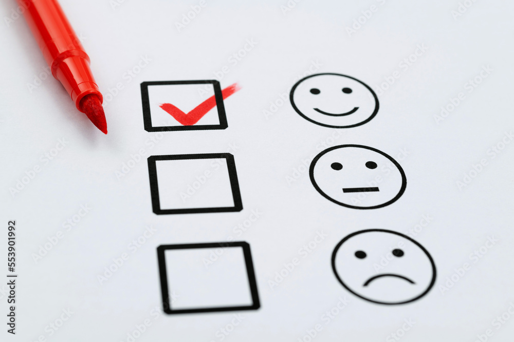 Tick the smiley face on checklist Stock Photo | Adobe Stock