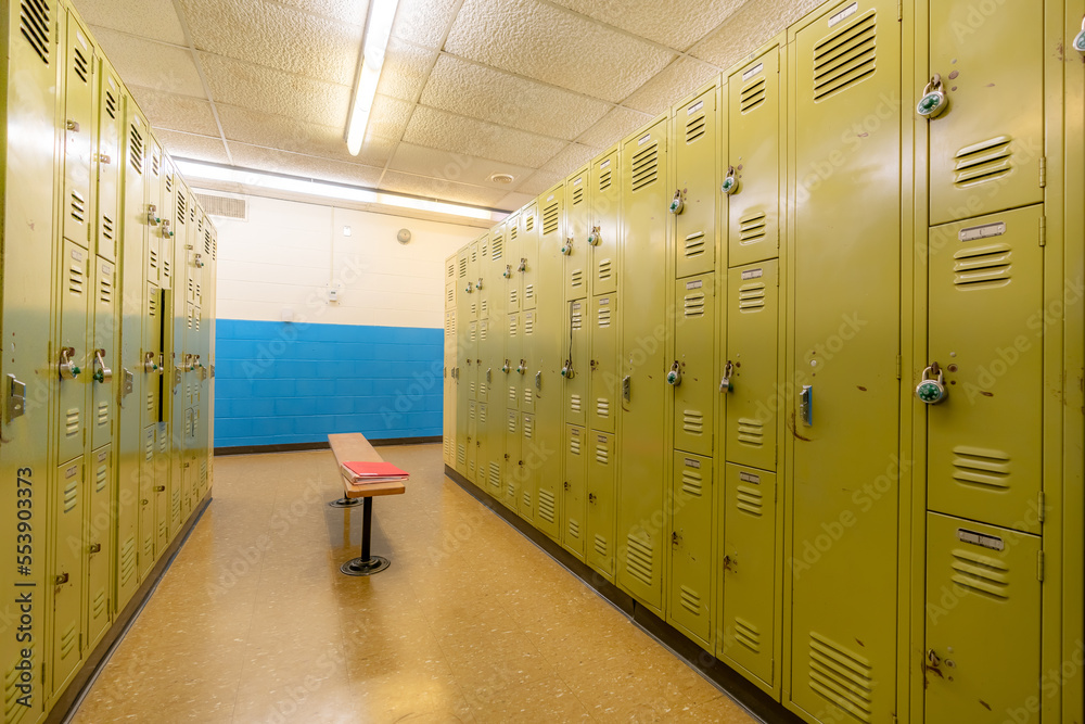 Old yellow and green metal gym, gymnasium, lockers with old drop ...
