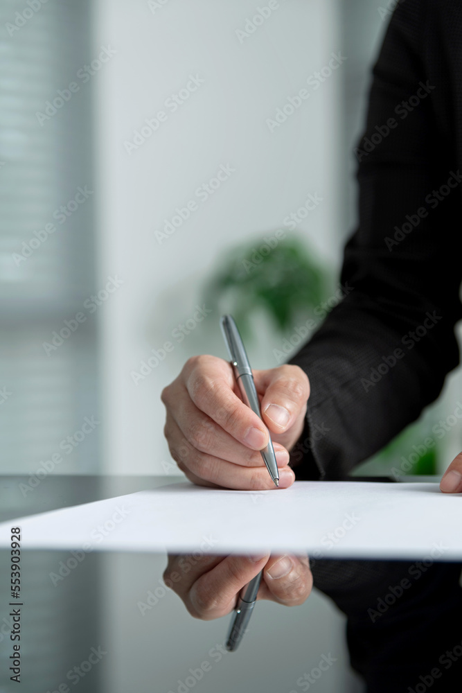 Businesswoman hand writing on paper Stock Photo | Adobe Stock