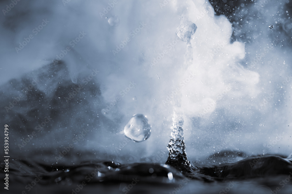 Boiling water splash with steam on black background closeup Stock Photo ...