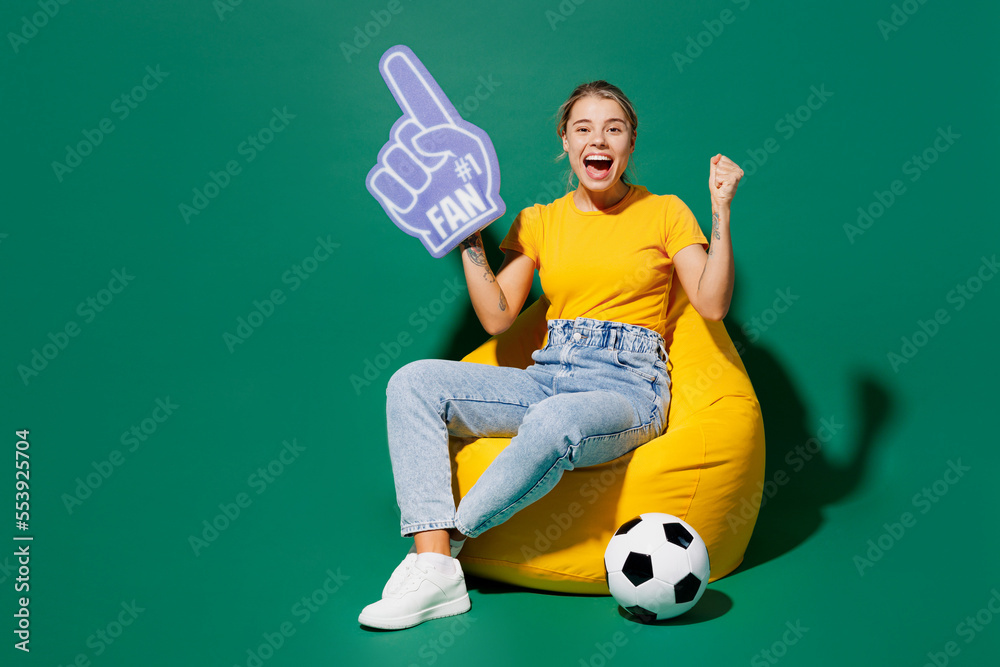 Full body young woman fan wear yellow t-shirt foam 1 fan glove finger ...