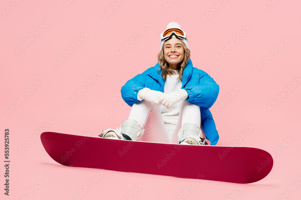 Bottom view fun snowboarder woman wear blue suit goggles mask hat ski ...