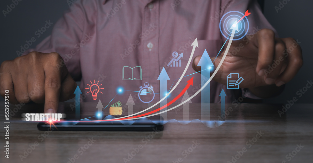 Businessman accessing startup business by mobile phone with icon ...