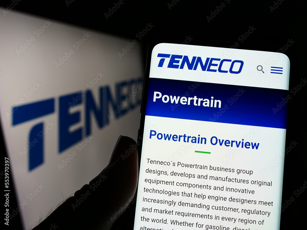 Stuttgart, Germany - 12-03-2022: Person holding cellphone with webpage of American automotive ...