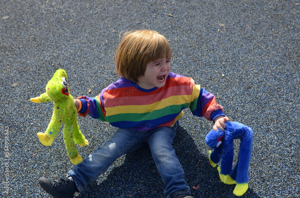 Little boy hysterical. Child whim. Soft toys Huggy Wuggy, violent ...