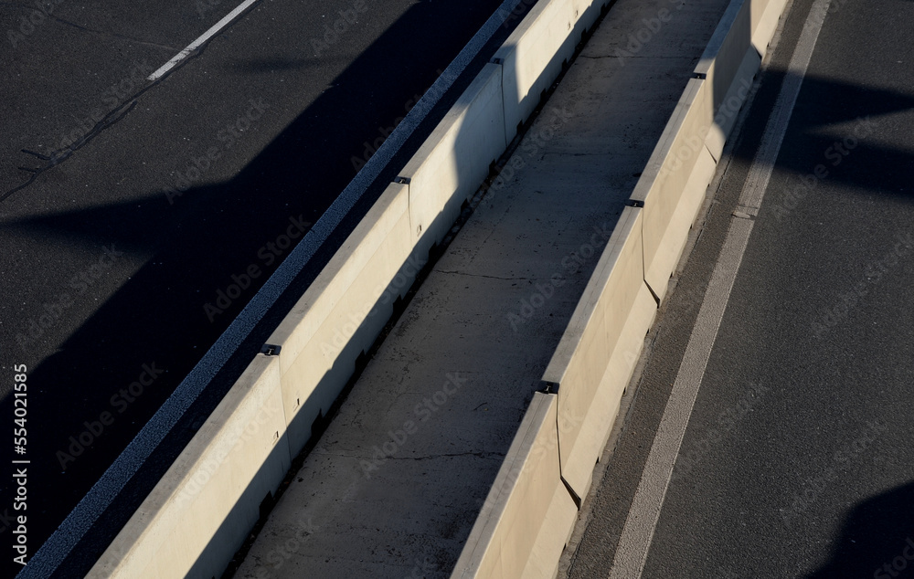 separation of lanes on the highway by means of heavy concrete barriers ...