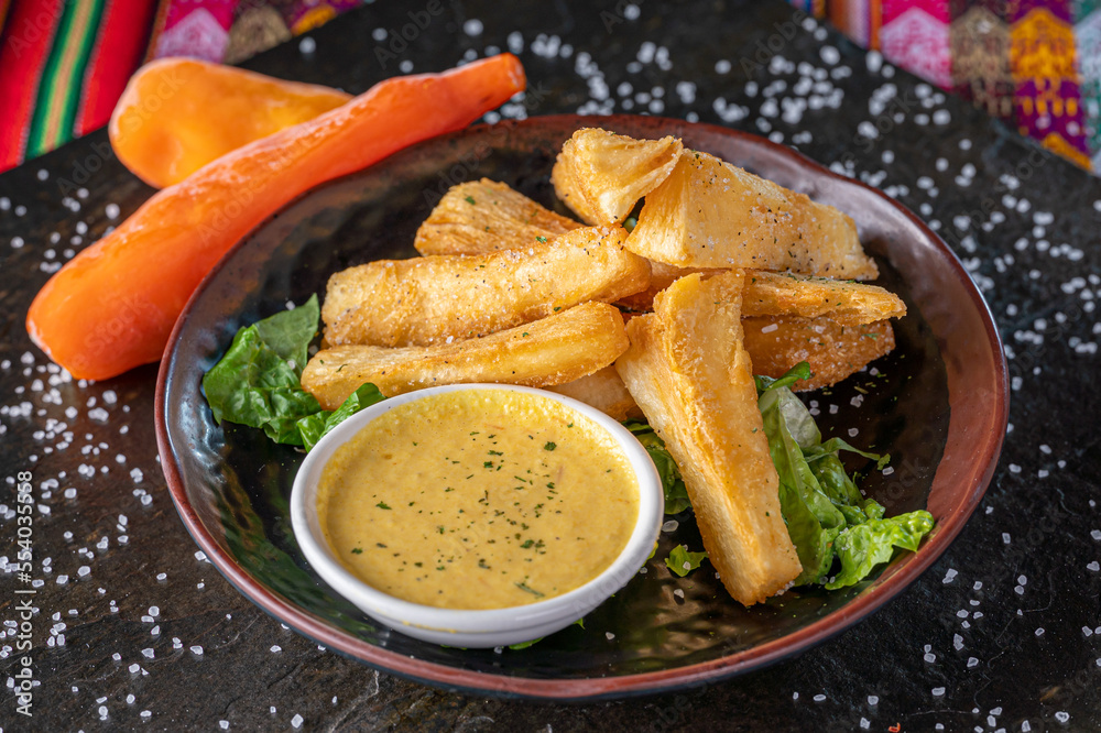 Yuquitas fritas, Peruvian yuca fries with dipping sauce. Stock Photo ...