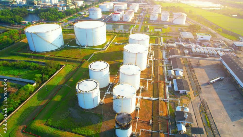 Aerial view above the oil storage tanks on the ground in oil ...
