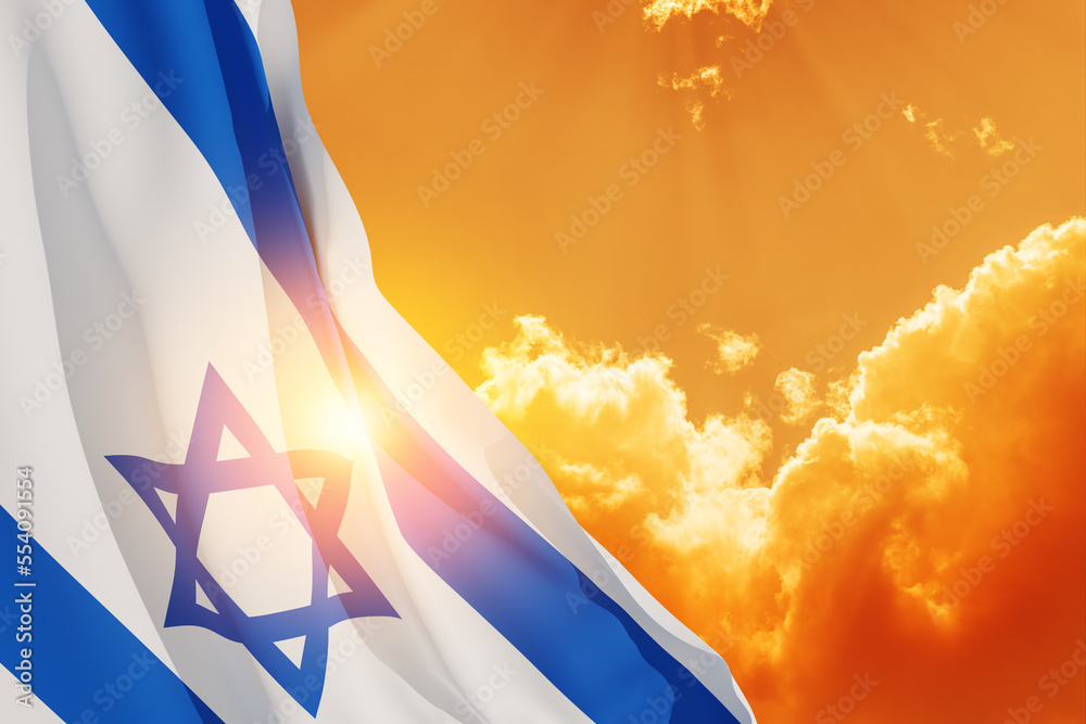 Israel flag with a star of David over cloudy sky background on sunset ...