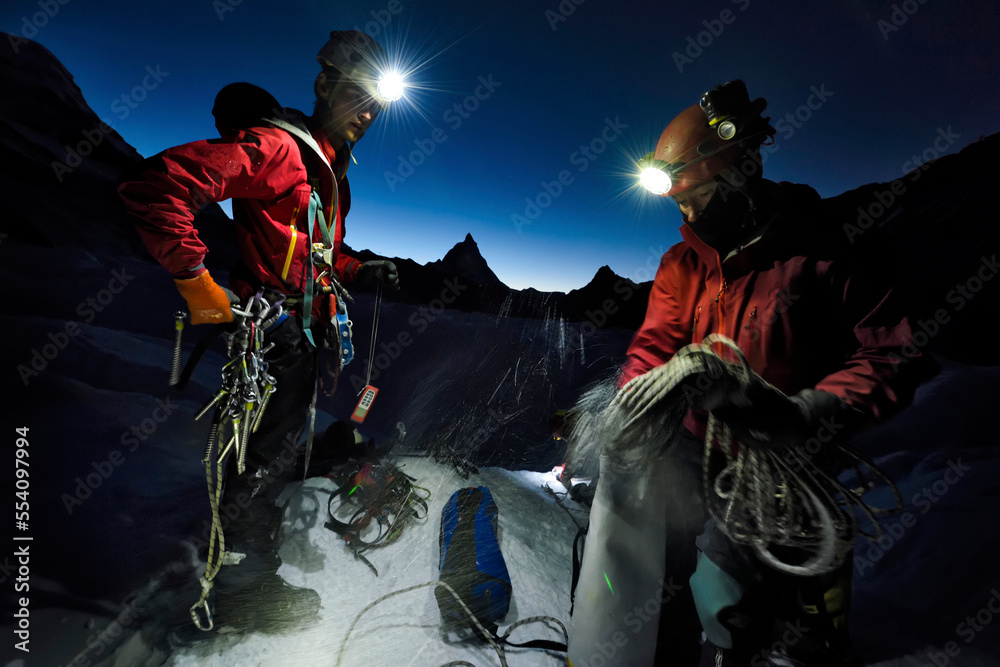 British cave explorers packing the climbing equipment before the cold ...