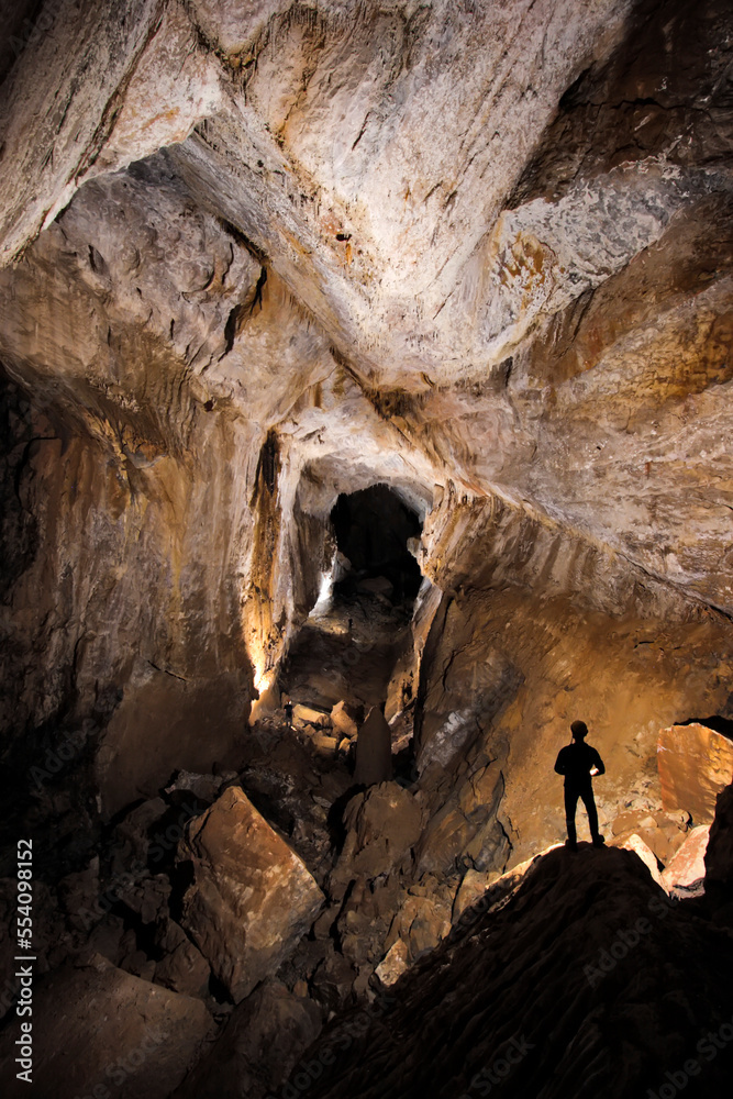 A Mulu Cave Project expedition member adds scale to a massive cave ...