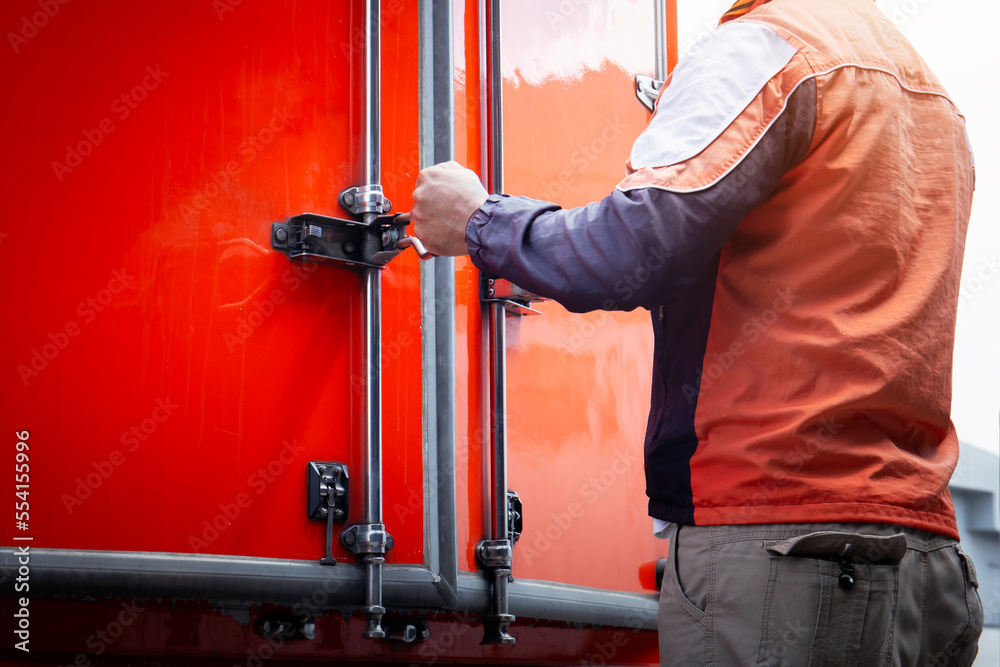 Delivery Man Closing The Door of A Container Van. Cargo Container Door ...