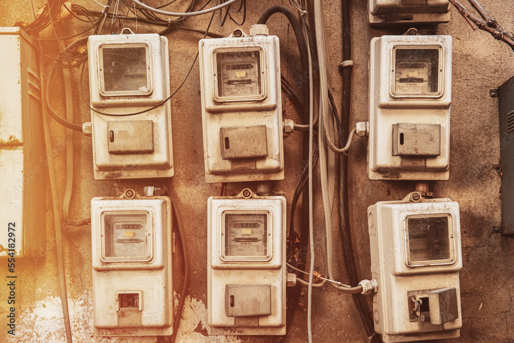 Various Electric Meters Stand A Row. Energy Consumption Concept. Impact ...