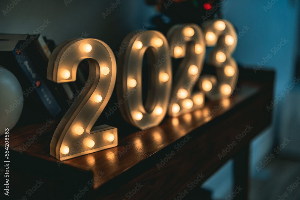 2023 sign lit up in the dark room Stock Photo | Adobe Stock