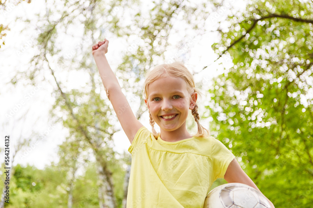 Smiling girl winning soccer game during summer holiday Stock Photo ...