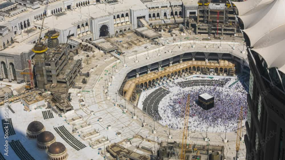 Time lapse of Muslim pilgrims circling around the holy Kaaba at noon ...
