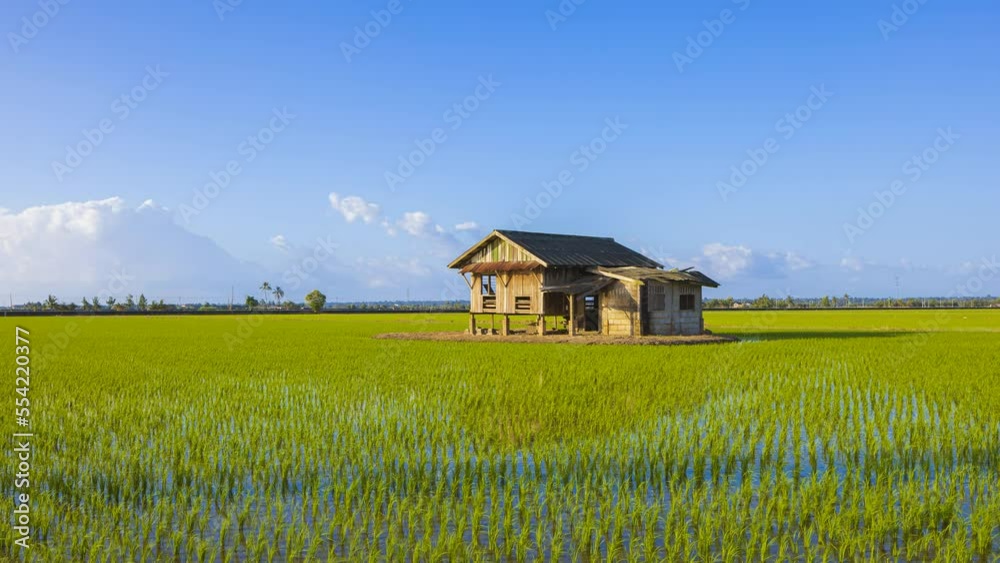 Time lapse of a afternoon view at an abandoned house in the middle of a ...