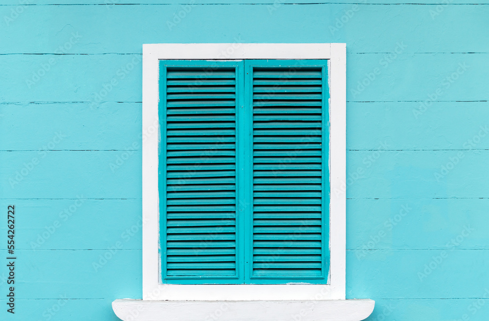 Colonial style turquoise wooden facade with window in Santa Ana Hill ...