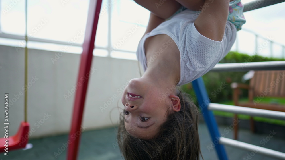 Kid falling from monkey bar child hanging upside down falls down to the ground Stock Photo ...