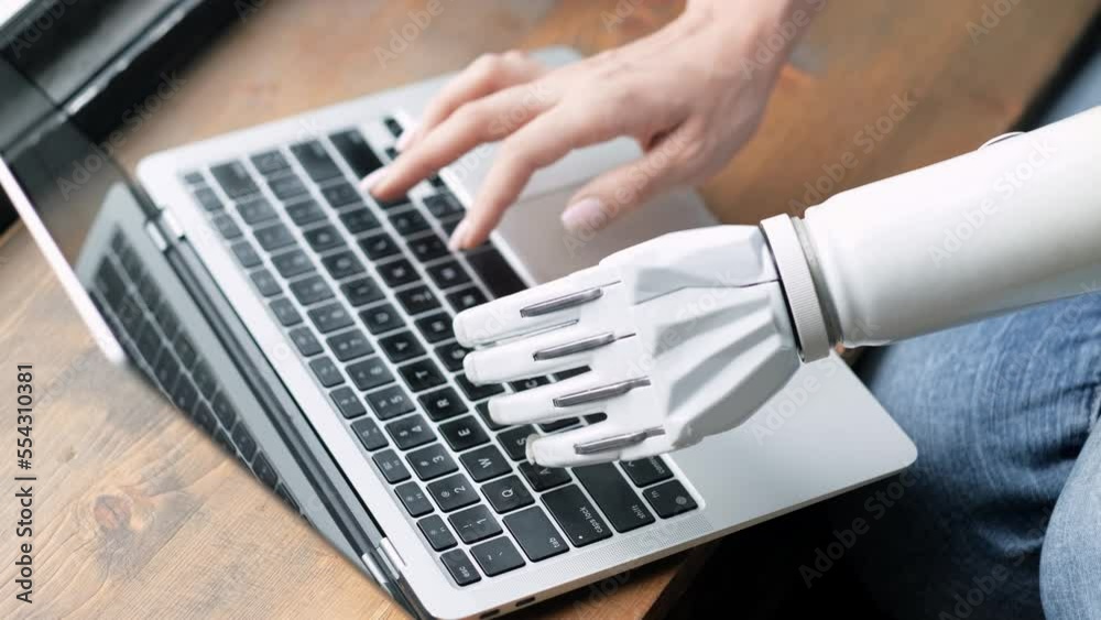 Stockvideo Motivated woman using prosthetic arm working or learning ...