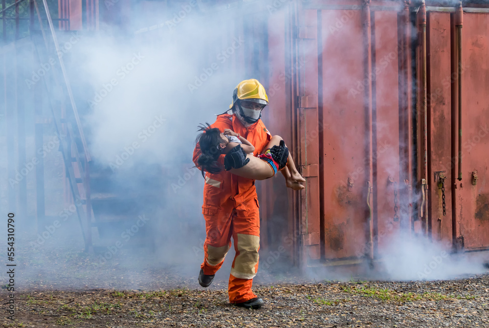 Firefighter to save girl in fire and smoke. Rescue Team or Firefighters ...