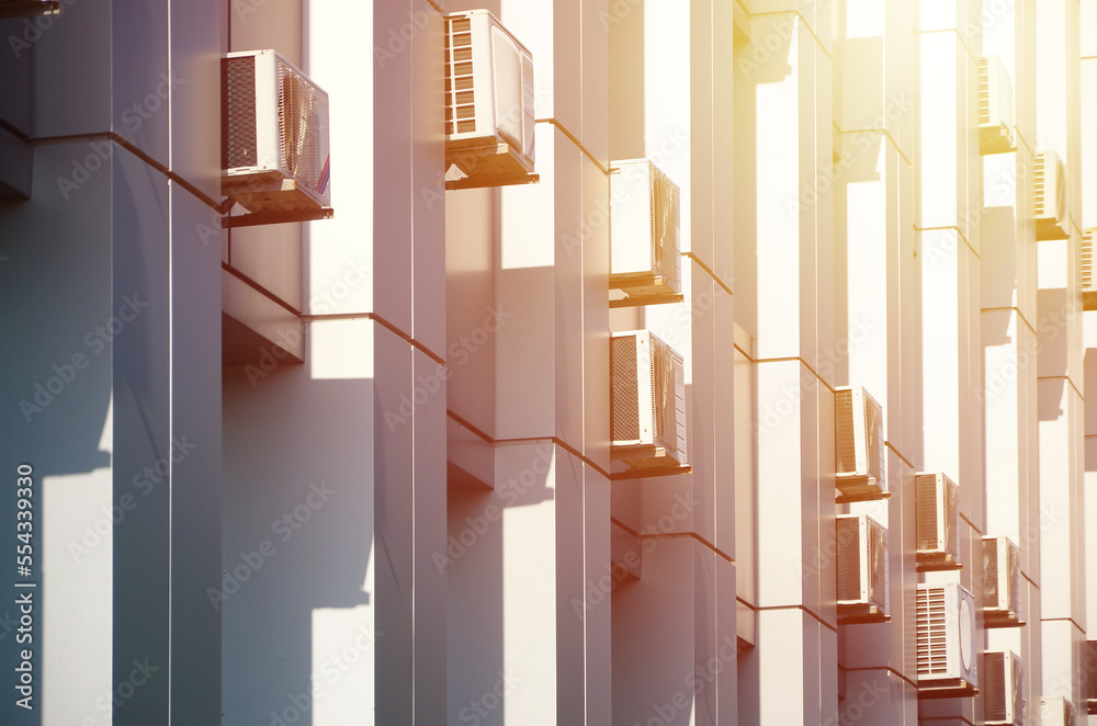 Many HVAC air conditioning and ventilation systems on wall. Outdoor Air ...