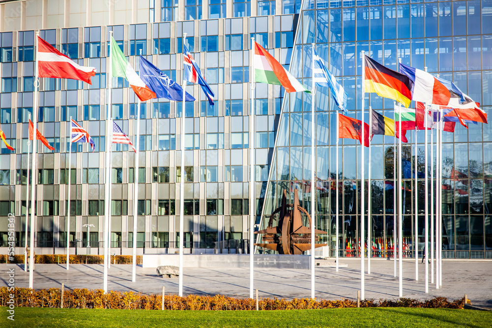 NATO building headquarters with flags and symbol outside Stock Photo ...