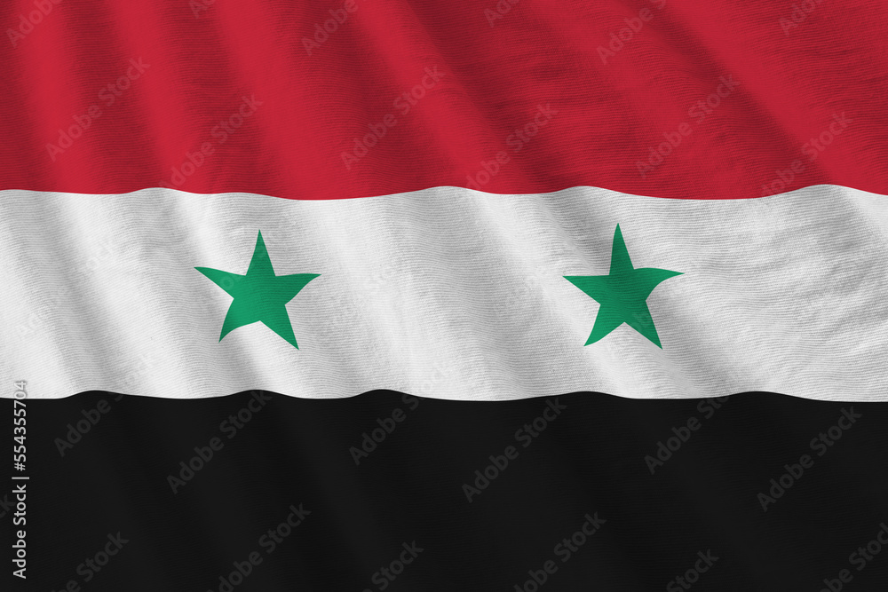 Syria flag with big folds waving close up under the studio light ...