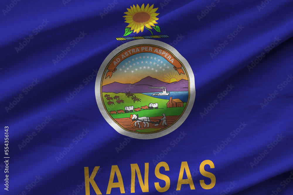 Kansas US state flag with big folds waving close up under the studio ...