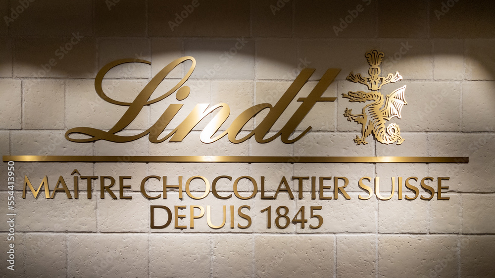 Lindt logo text and brand sign shop interior store wall of Swiss ...