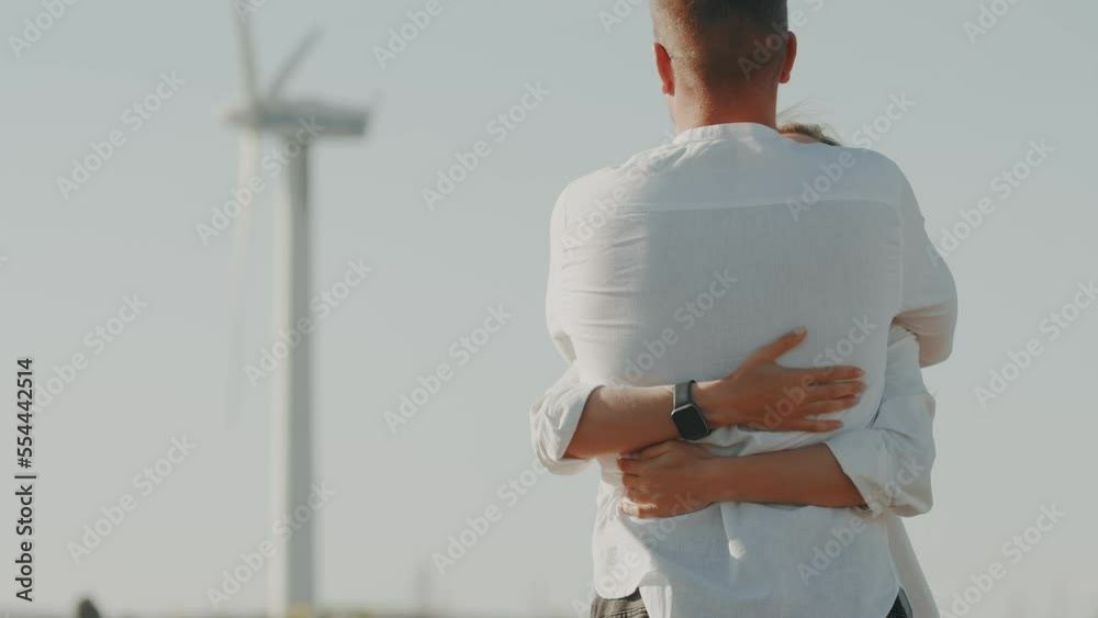 White man and white woman gently embracing with each other outdoor with ...