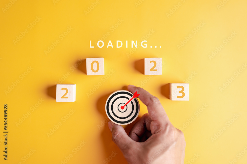 Target plan next year 2023 concept, Hand putting wooden cube block for ...