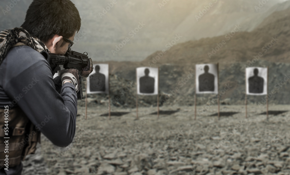 Man soldier military aiming and shooting assault rifle at shooting ...