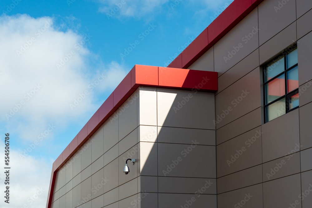 The exterior wall of a contemporary commercial style building with ...