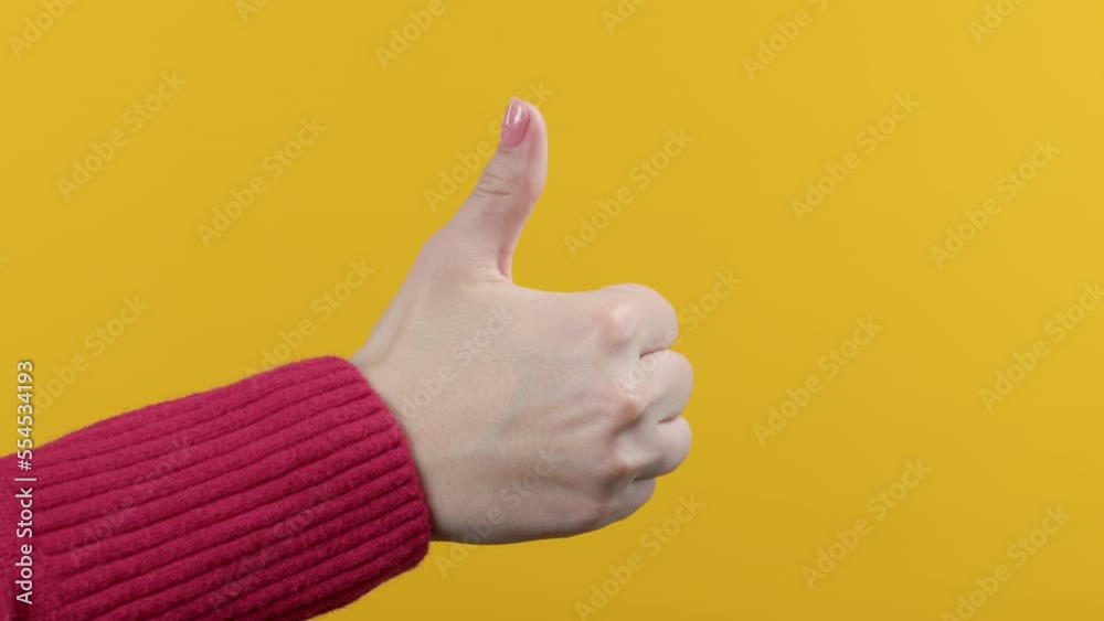 Woman makes hand sign like, thumb up gesture. Correct perfect choice ...