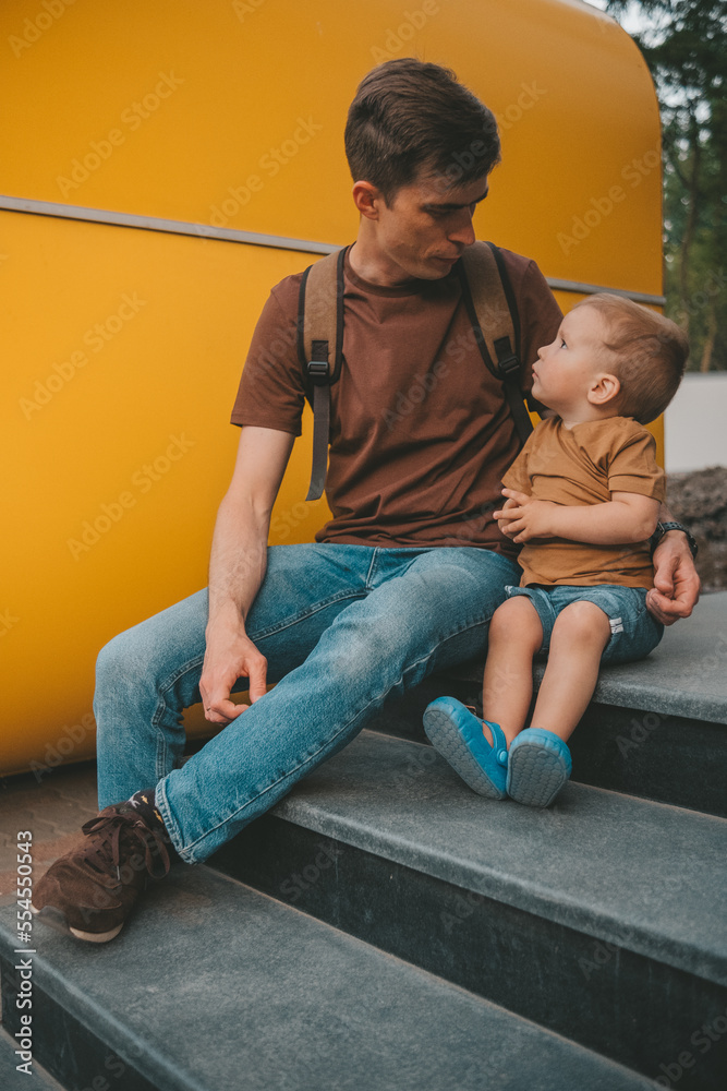 Family fun. Dad and child have a good time together.dad looks for son ...